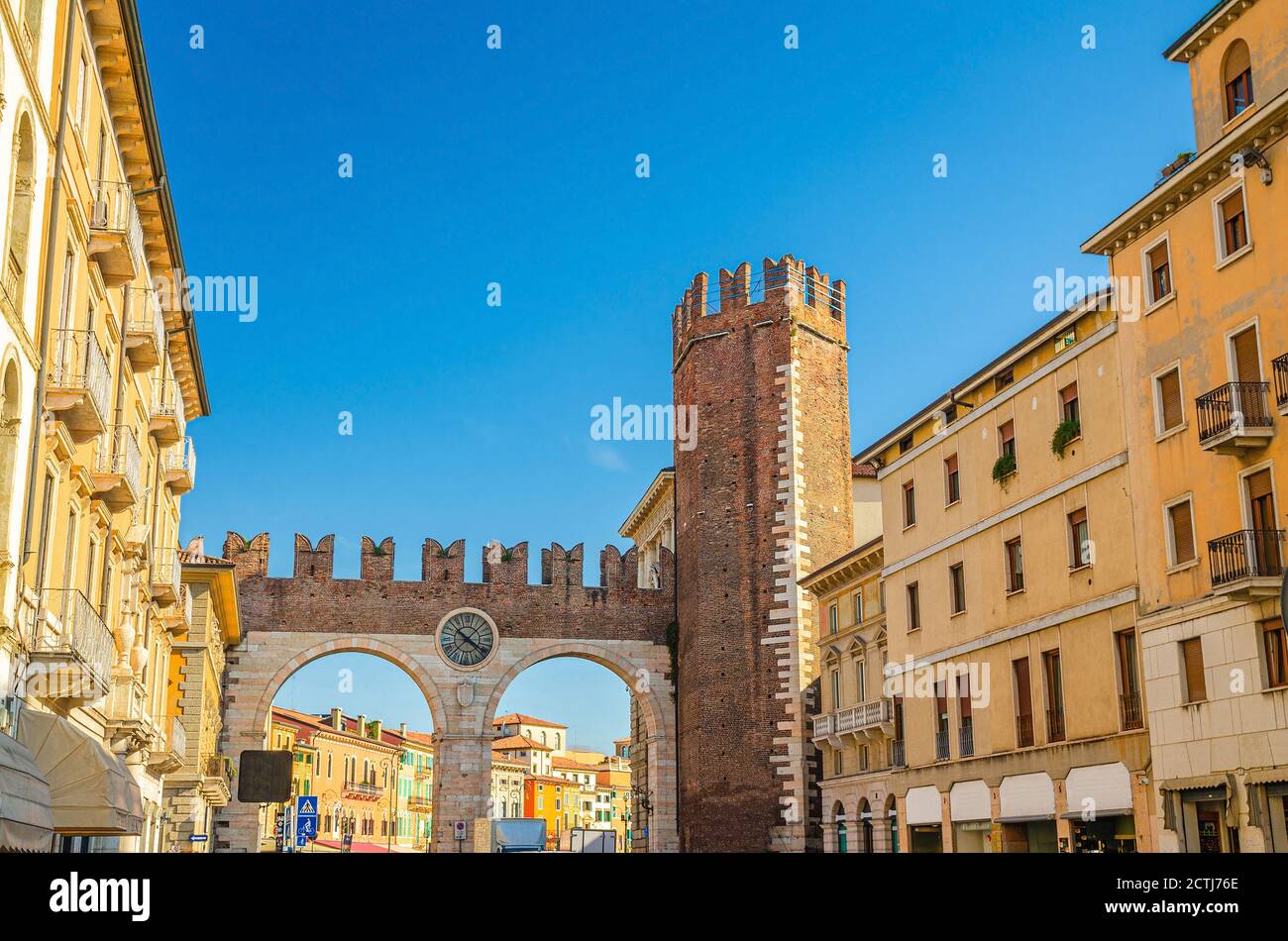 Portoni della Bra gate with merlons and clock, old Roman city double ...