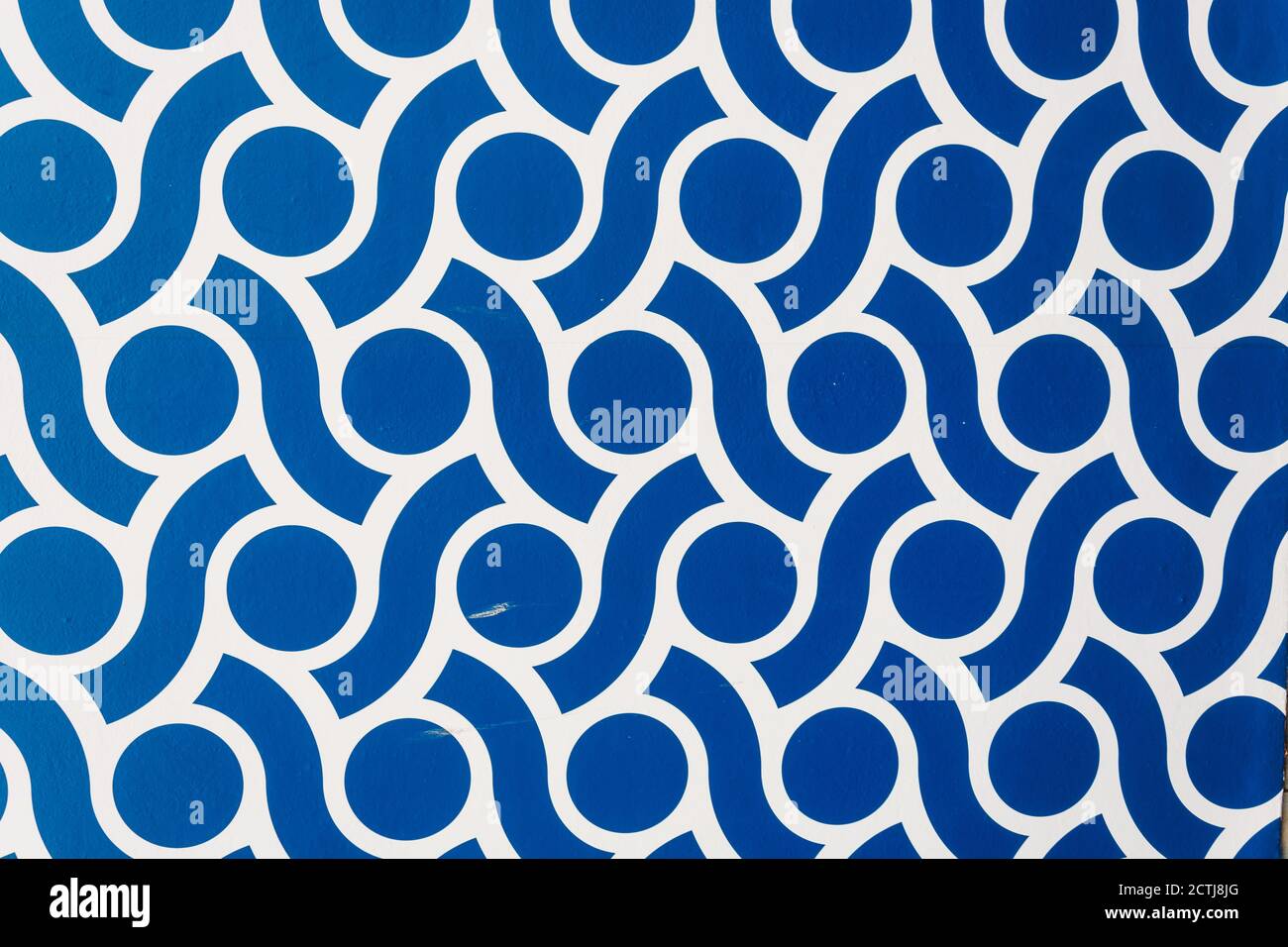 Closeup of a blue and white rotating pattern on the wall Stock Photo ...