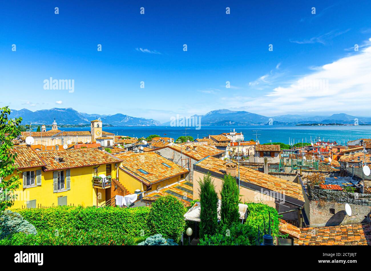 Aerial panoramic view of Desenzano del Garda town with red tiled roof ...