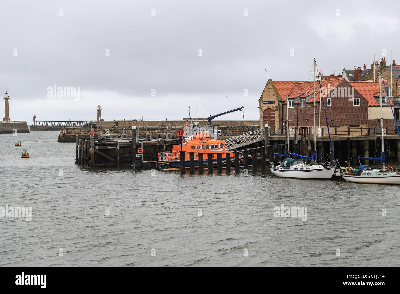 Whitby lifeboat docked on the pier Stock Photo - Alamy