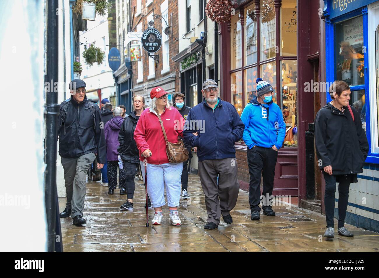 The back streets of Whitby remain busy as the rain continues to pour ...