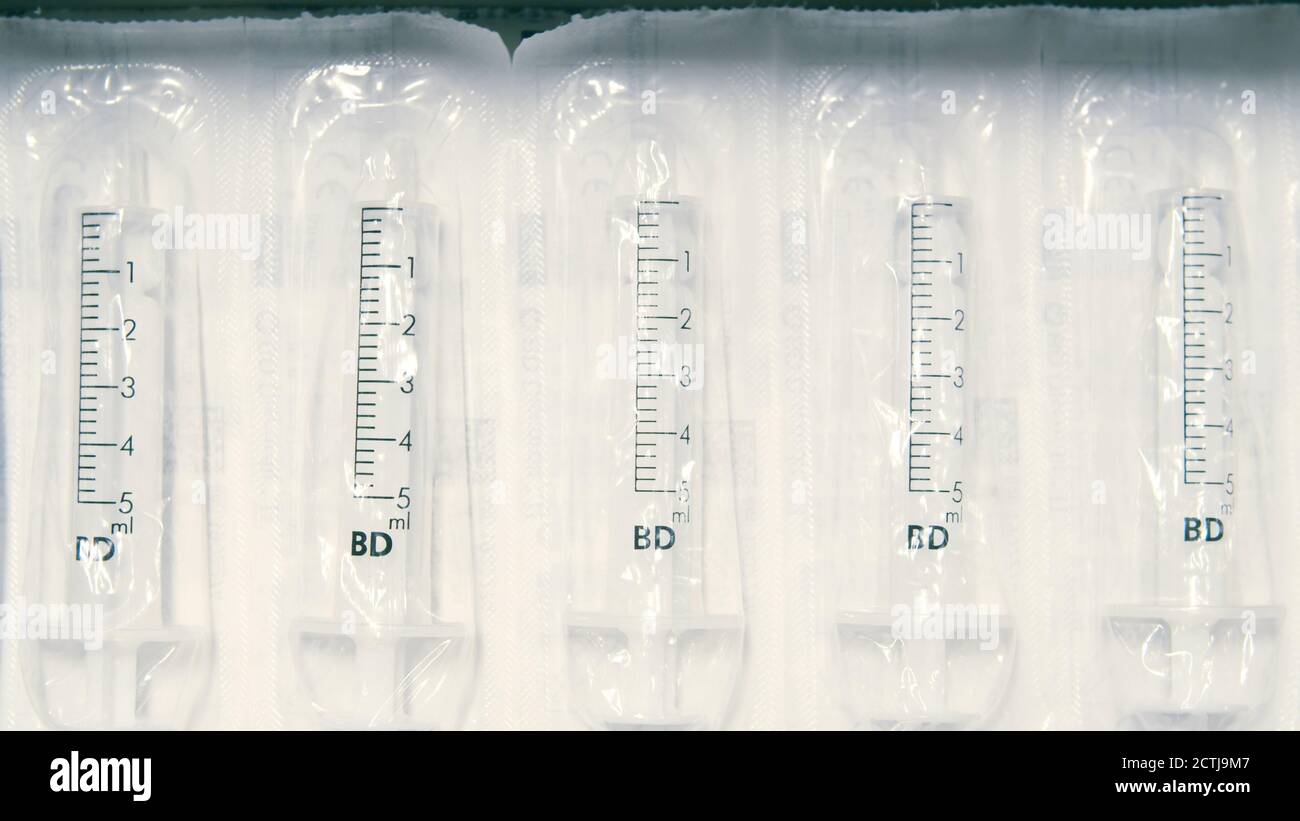 Pack of blank plastic syringes without injection needle. Vaccination or ...