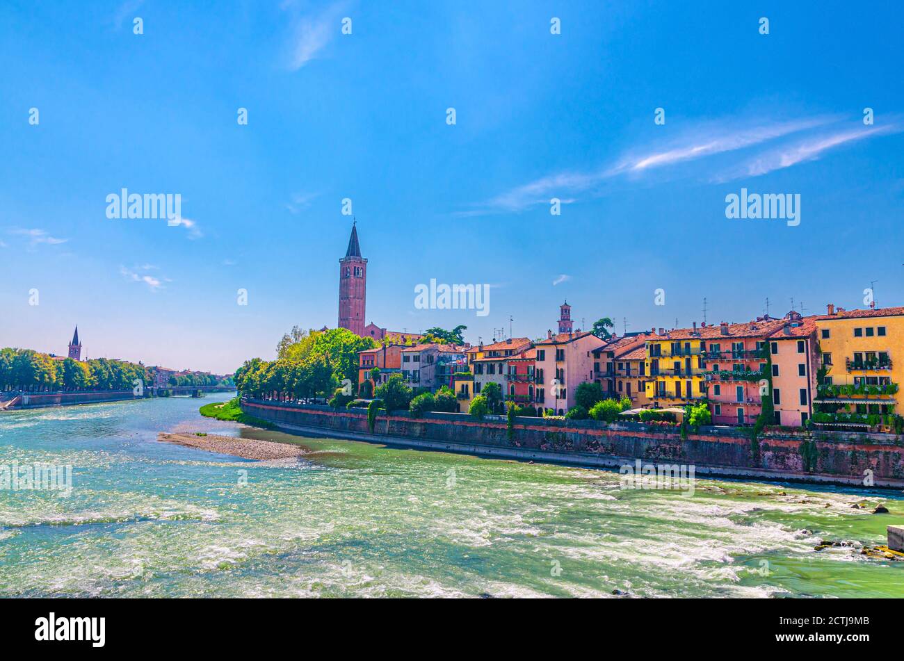 Verona cityscape with buildings on embankment of Adige river, bell ...