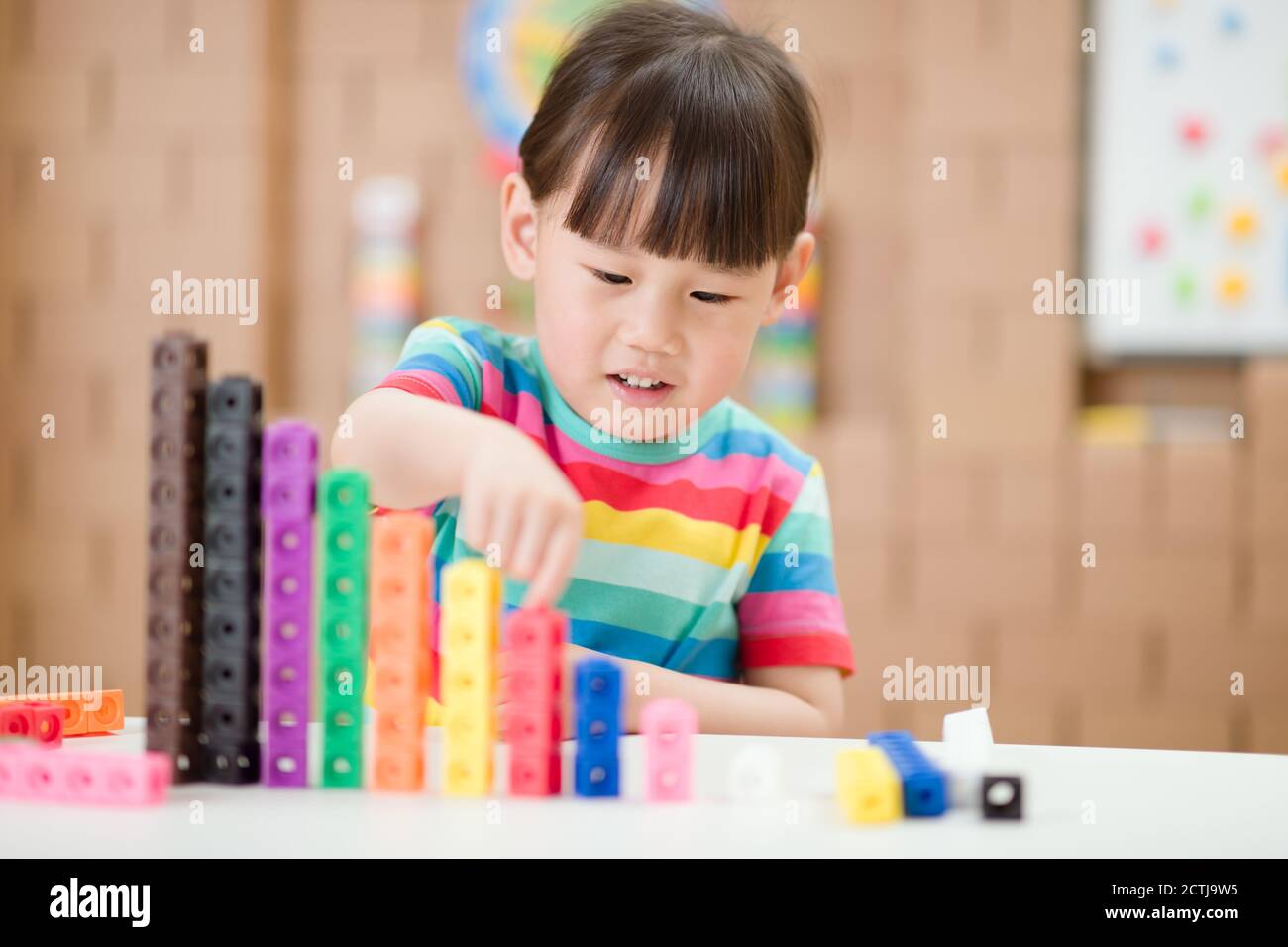 young girl play number blocks for homeschooling Stock Photo - Alamy