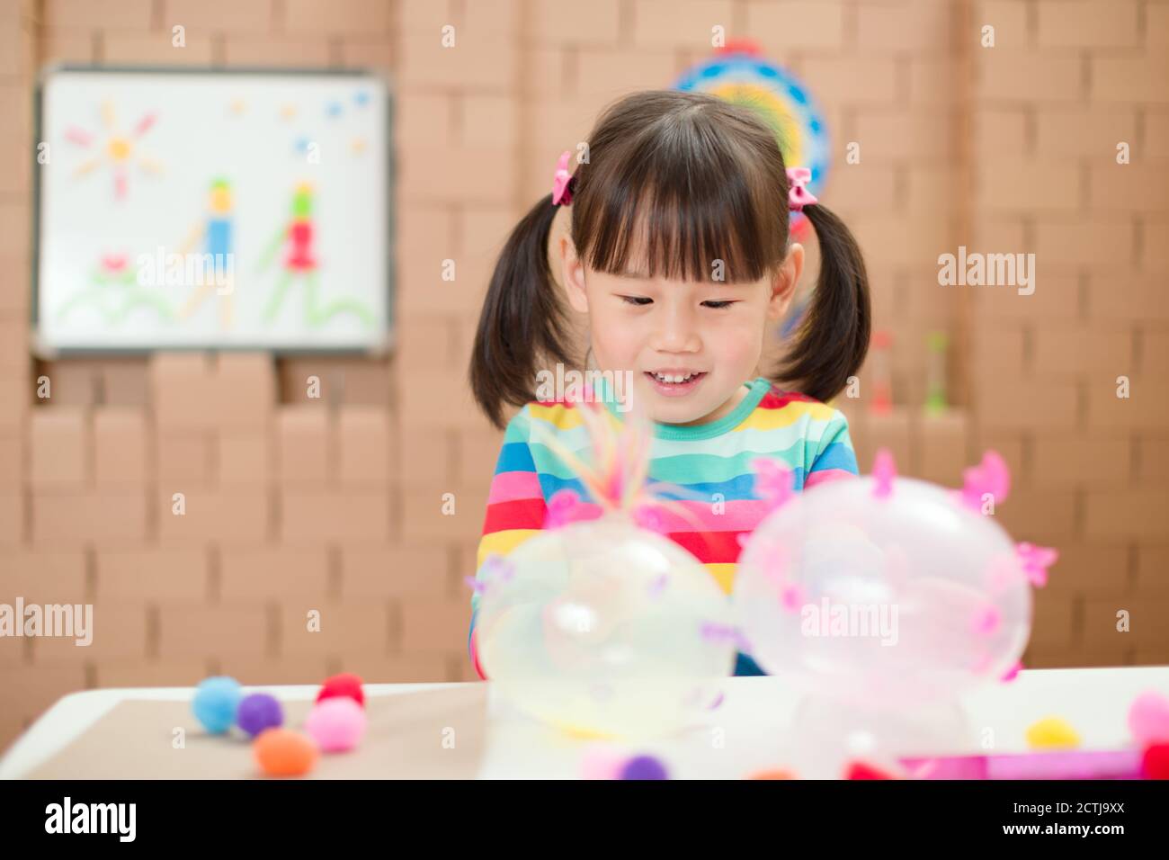 young girl making craft for homeschooling Stock Photo - Alamy
