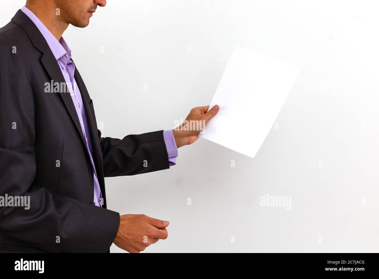 businessman holding a blank white board, signboard, showing an emty ...