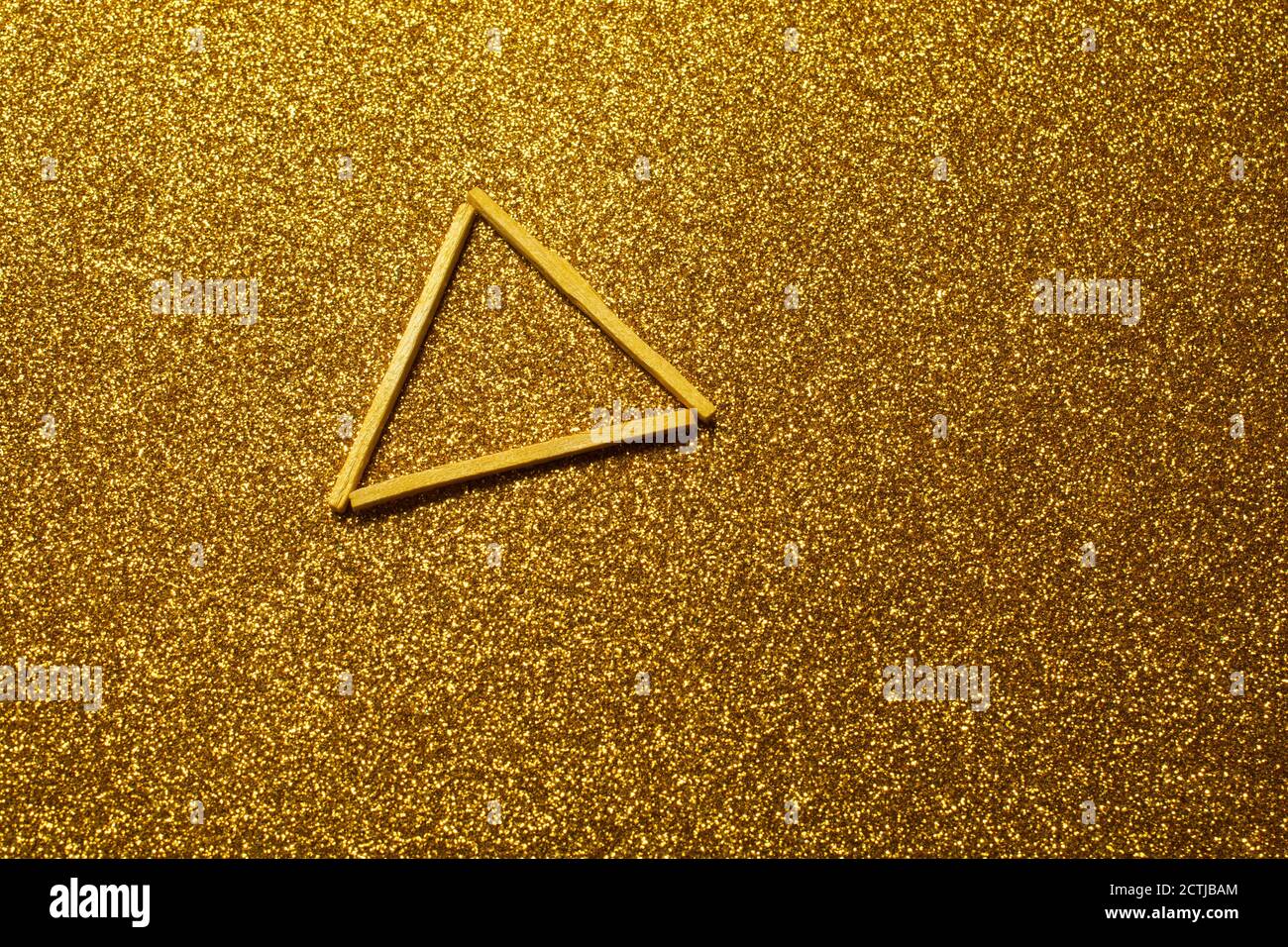 Triangle made from wooden sticks Stock Photo - Alamy