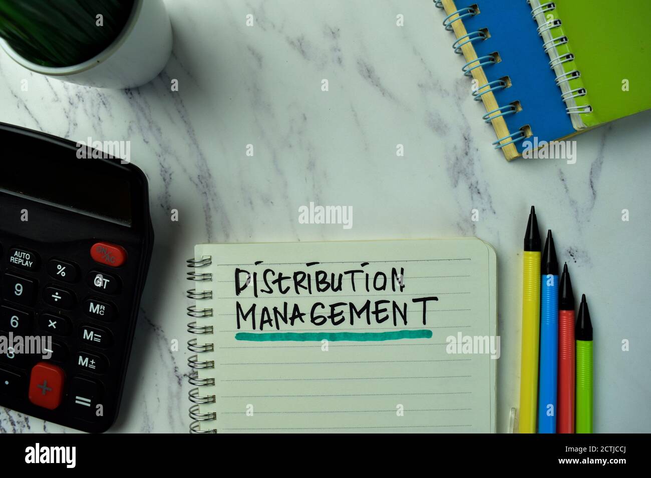 Distribution Management write on a book isolated on office desk Stock ...