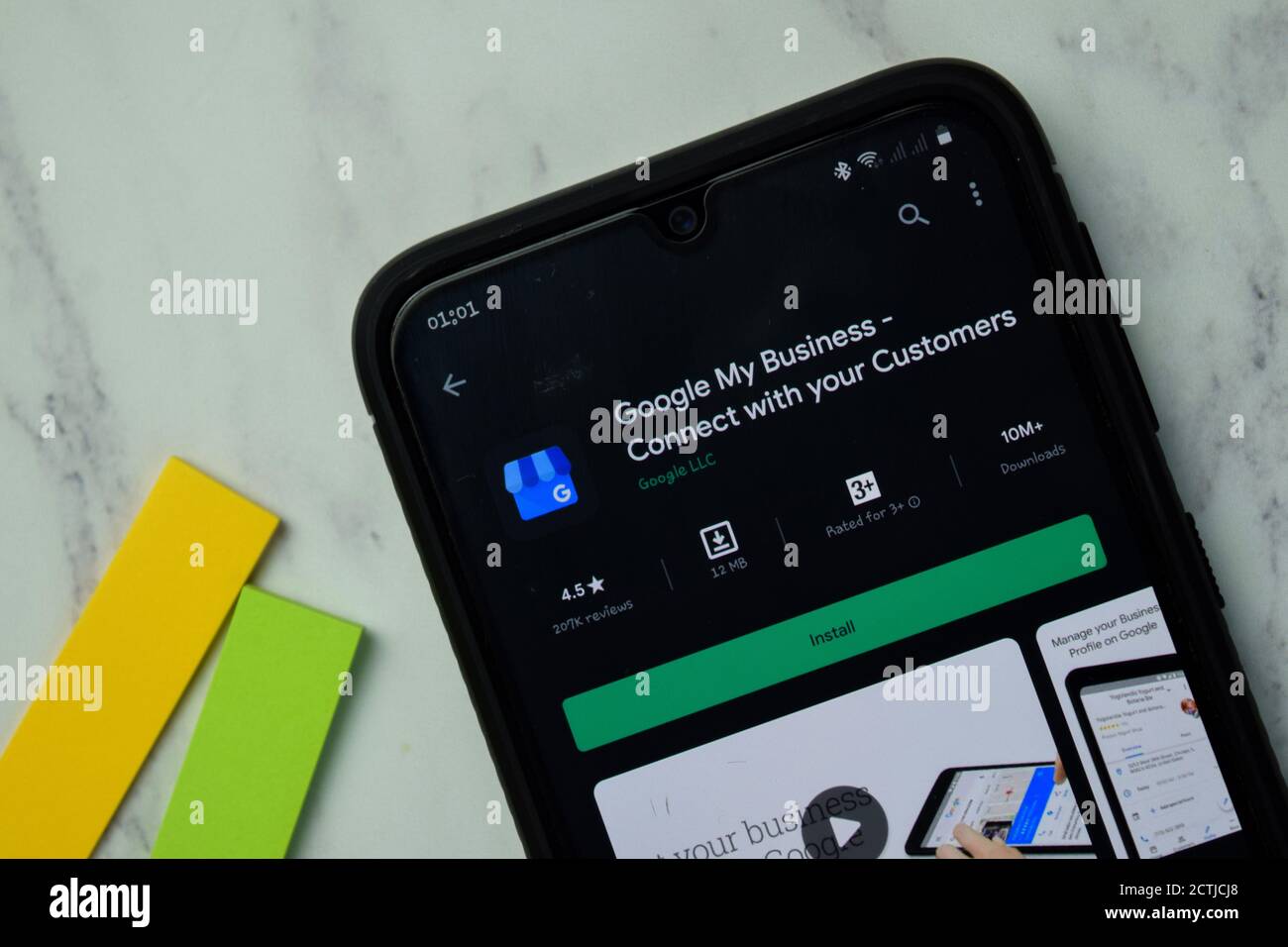 Google My Business dev app with magnifying on Smartphone screen. My ...