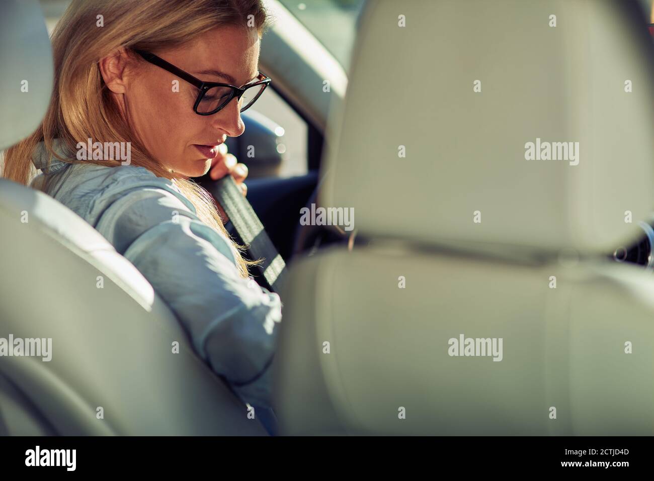 Girl behind steering wheel hi-res stock photography and images - Alamy