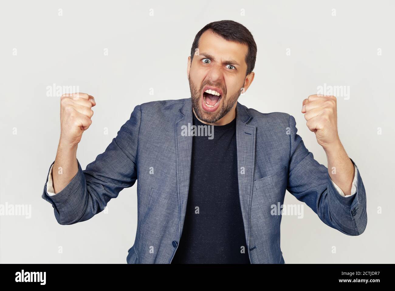 Angry man shouting hands raised hi-res stock photography and images - Alamy