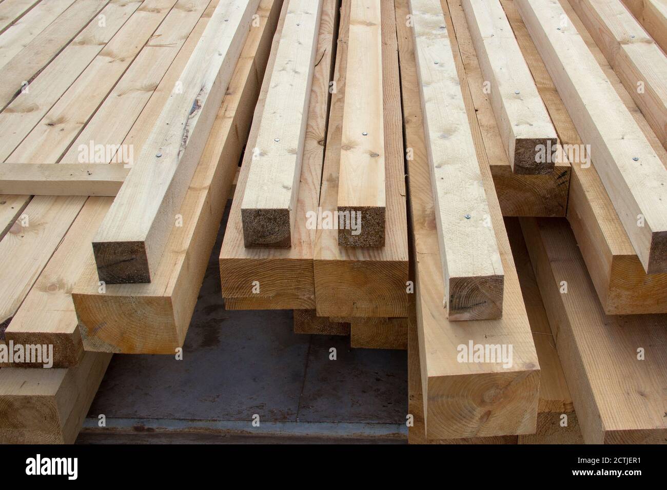 Large wooden beams for construction. Building material. Sawed beam ...