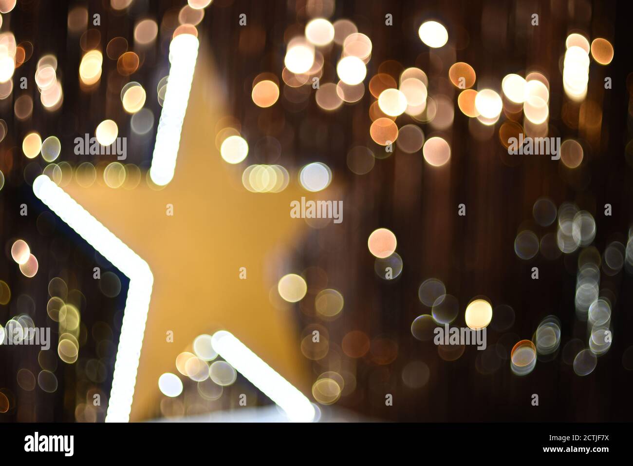 large glowing star turned to the side background blurred against the ...