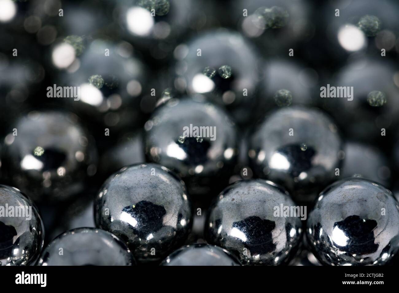 Metal balls with shiny reflections. The balls are arranged next to each ...