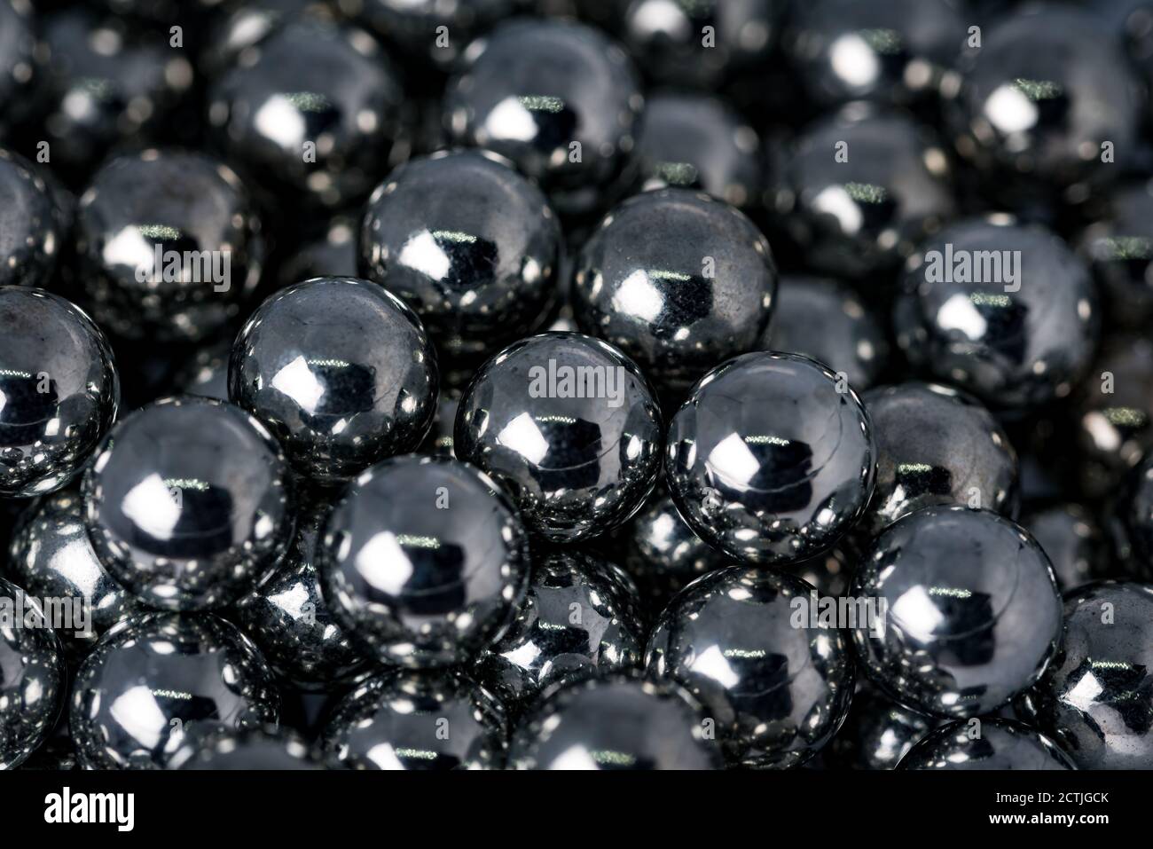 Metal balls with shiny reflections. The balls are arranged next to each ...