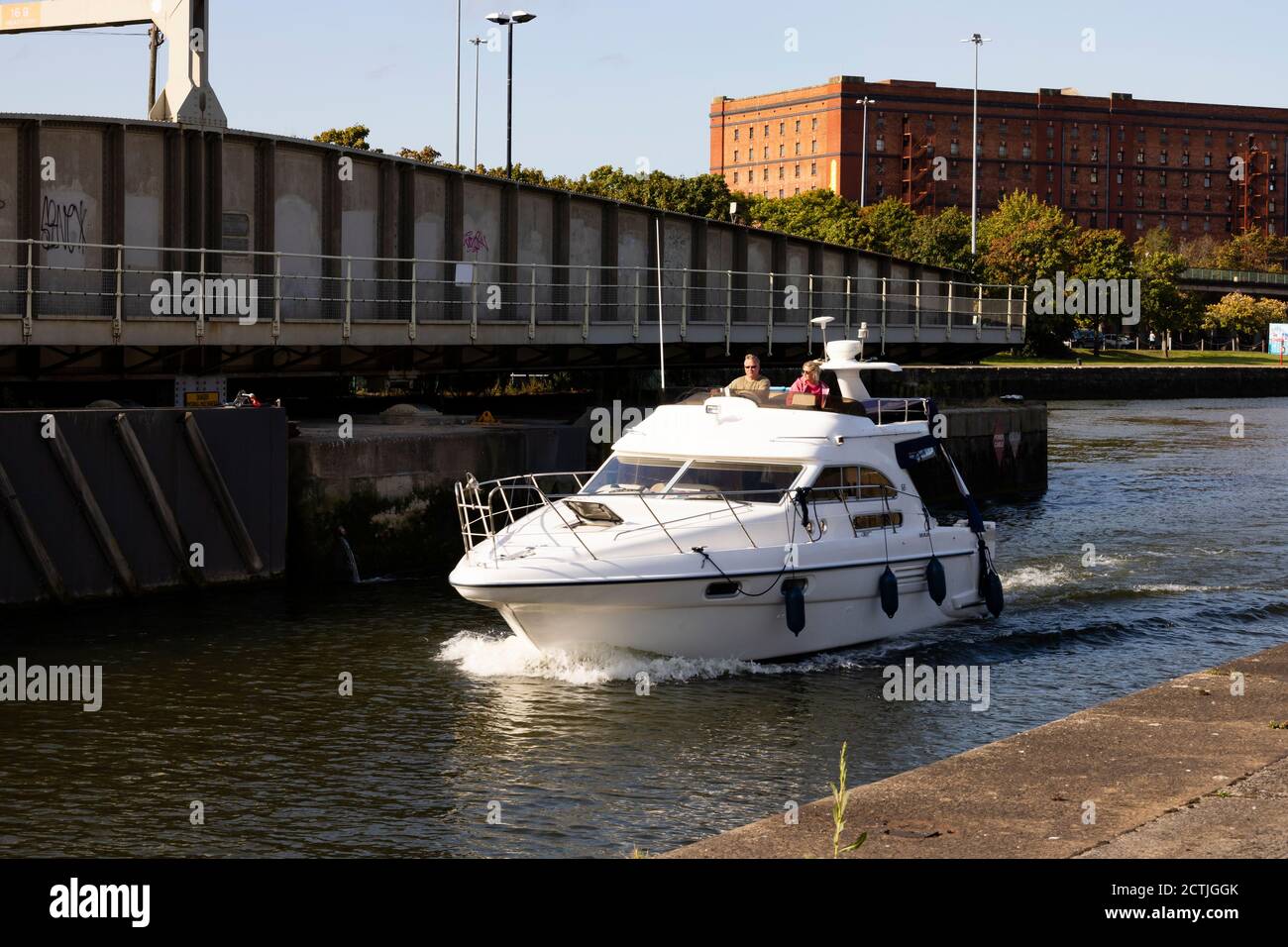 Merchants Road swing bridge and lock gates open for a boat to pass into ...