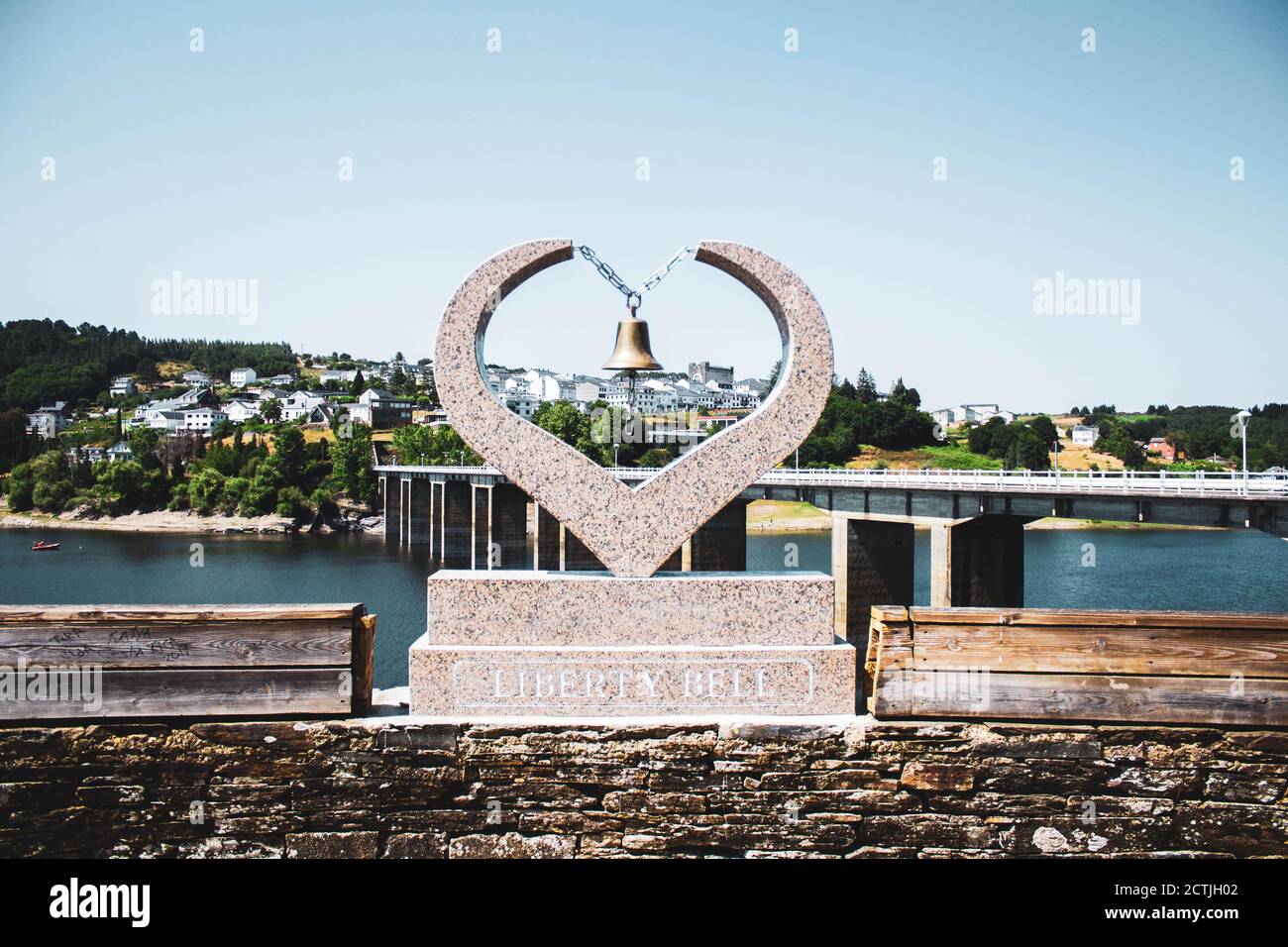 liberty bell statue with city in the background with white houses Stock ...