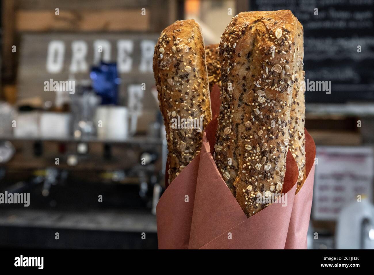 High angle of loaves of freshly baked rye bread with crunchy crust ...