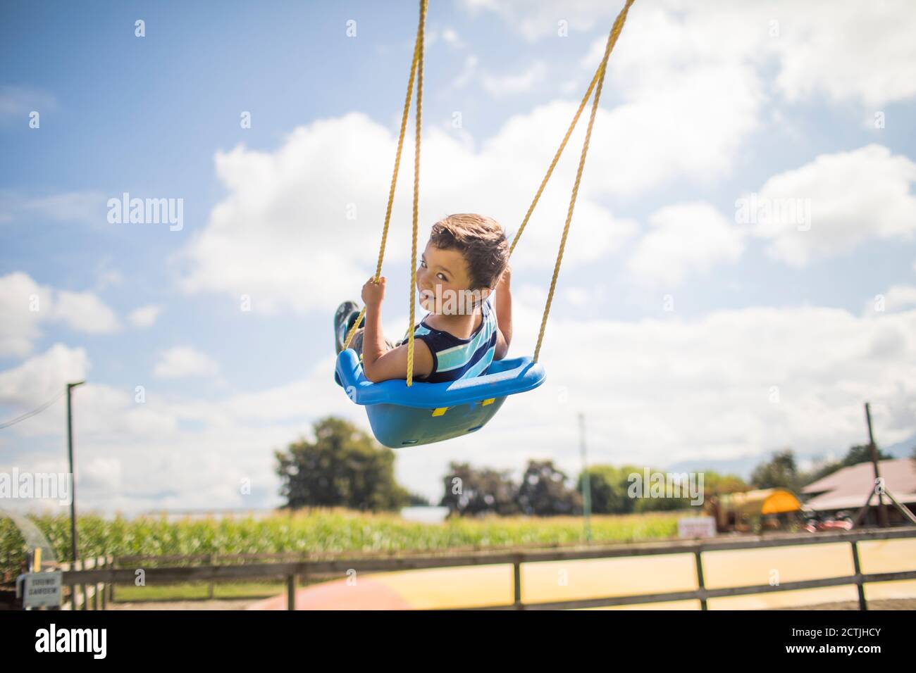 Boy swing low angle hi-res stock photography and images - Alamy