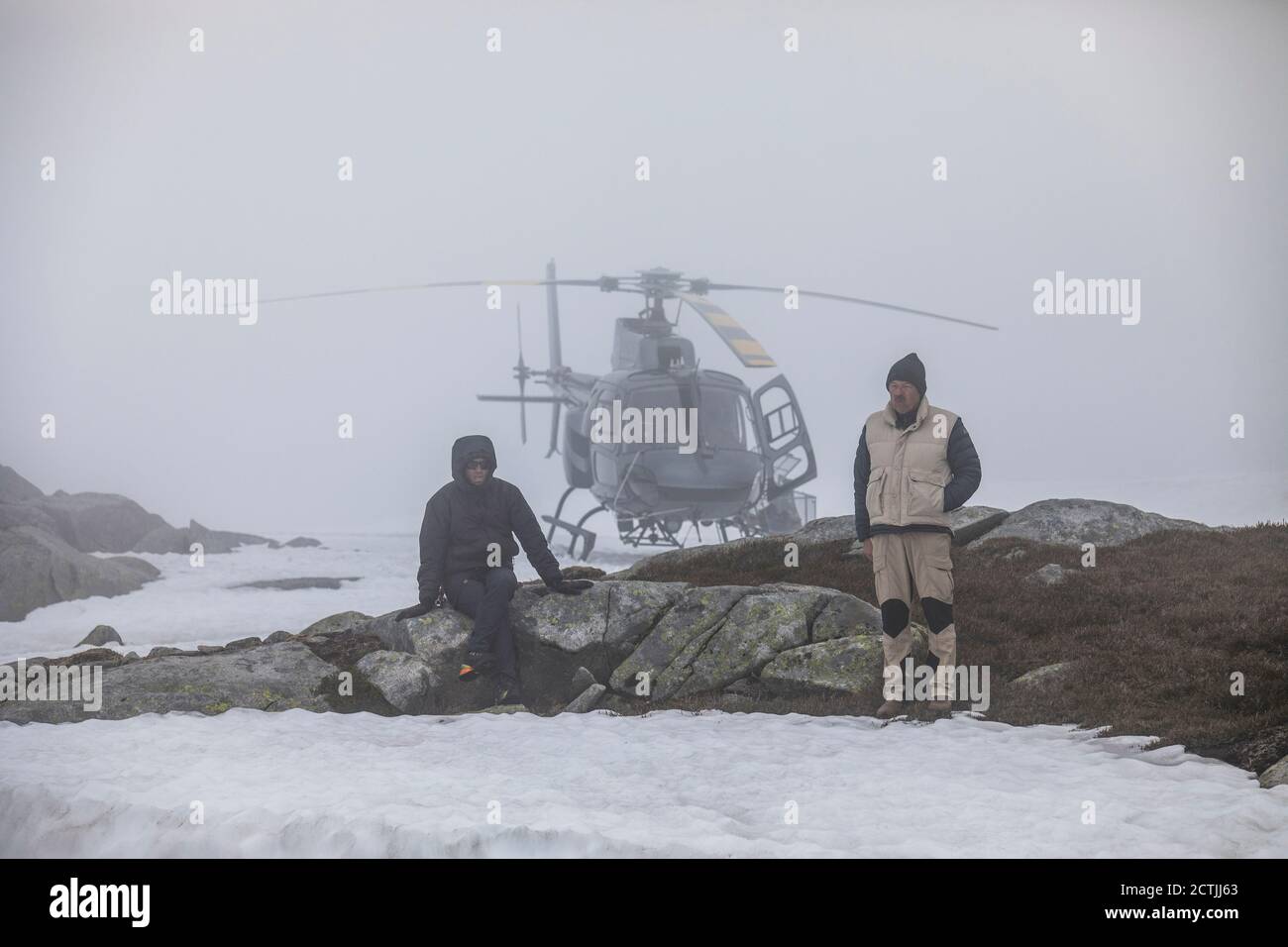 Helicopter pilot and passenger wait for improved weather, stranded ...