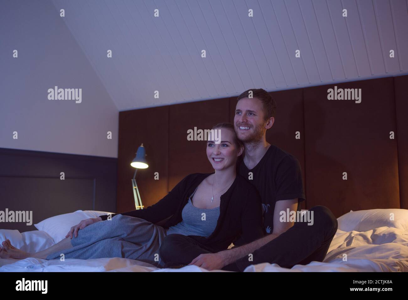 Couple watching movie cuddle hi-res stock photography and images - Alamy