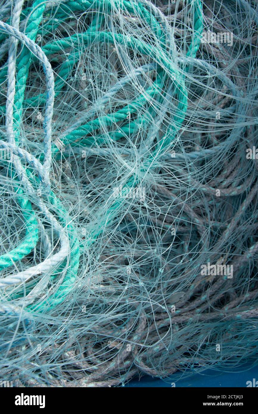 Vertical shot of old fishing ropes and nets under the sunlight Stock ...