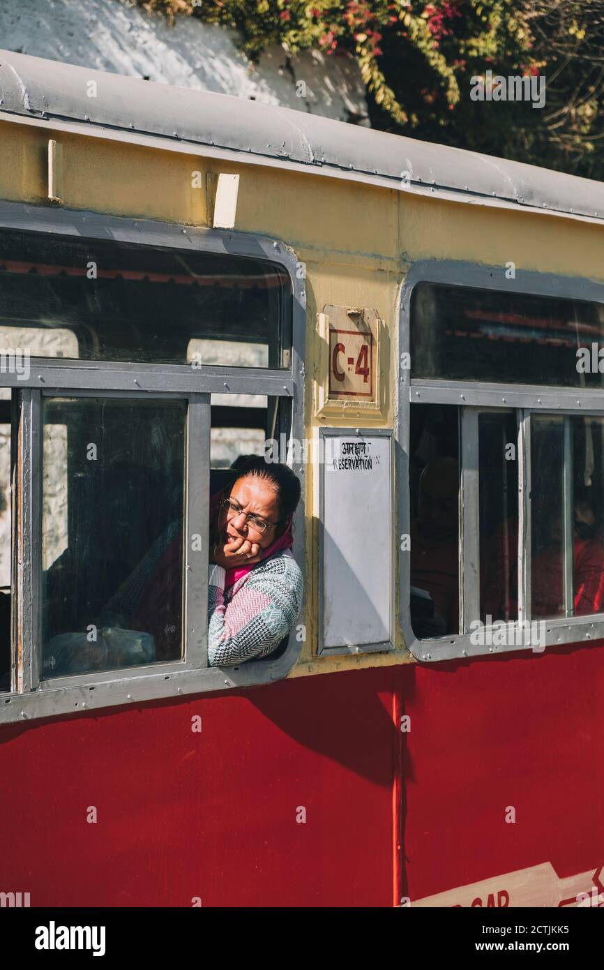 Indian woman looking through the Toy Train window awaiting for ...