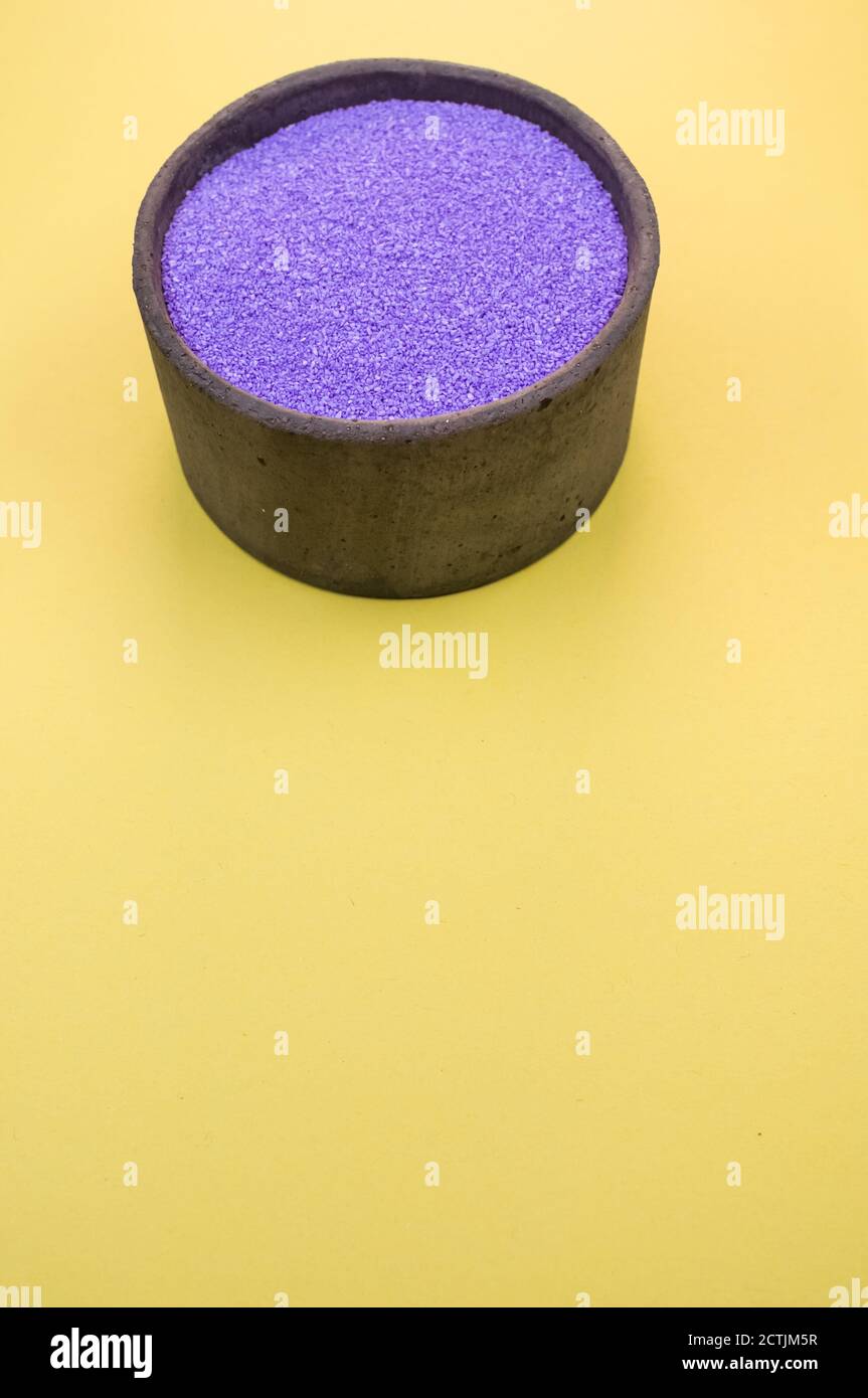 Shot of colored violet sand in a bowl Stock Photo - Alamy