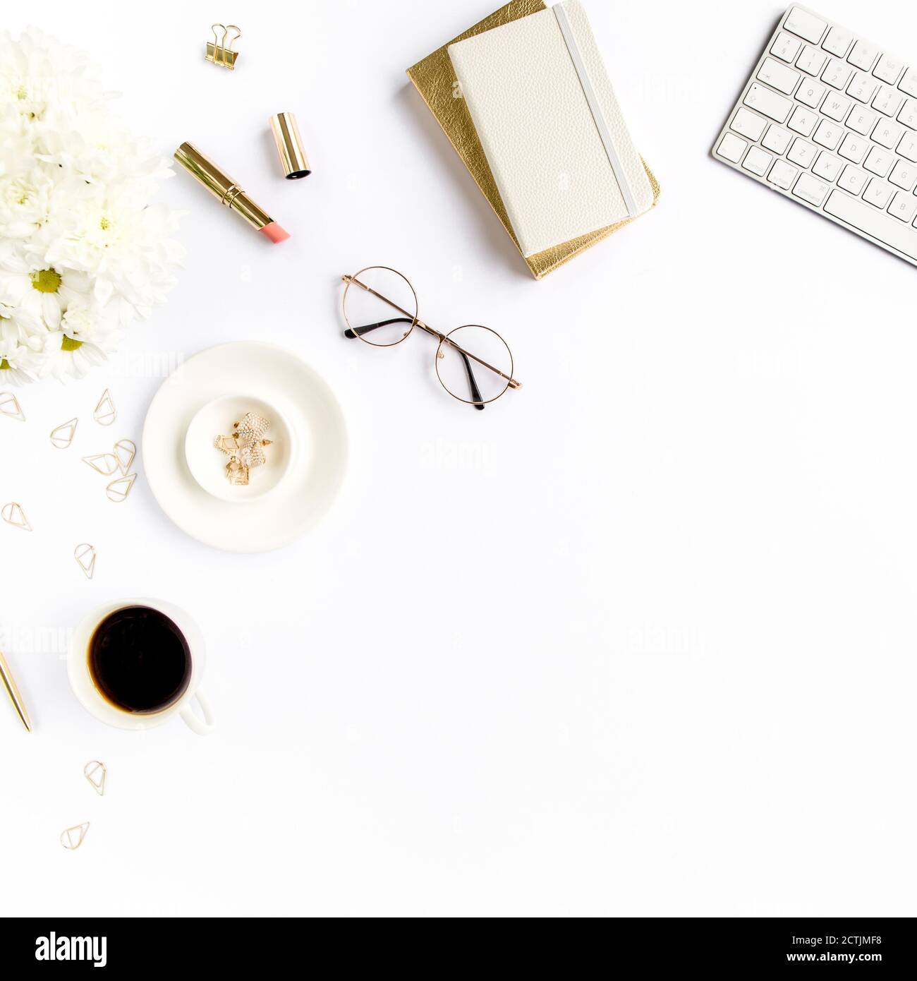 Women's stylish table desk. Workspace with computer, coffee and ...