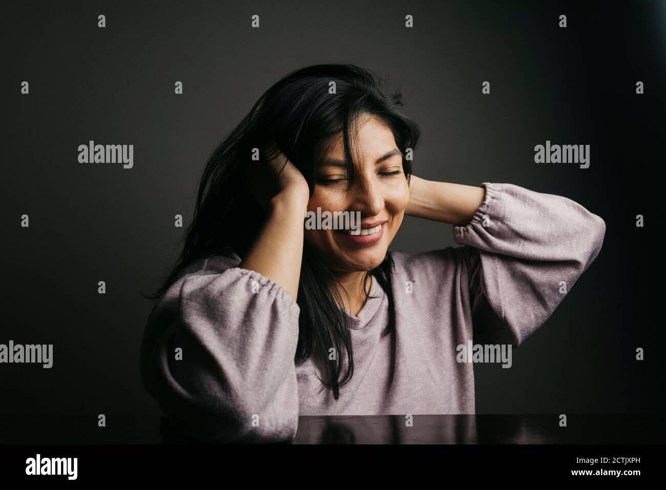 Black woman hands table hi-res stock photography and images - Alamy