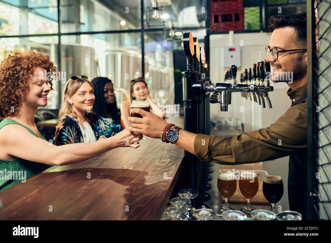 Handing drink glass hi-res stock photography and images - Alamy