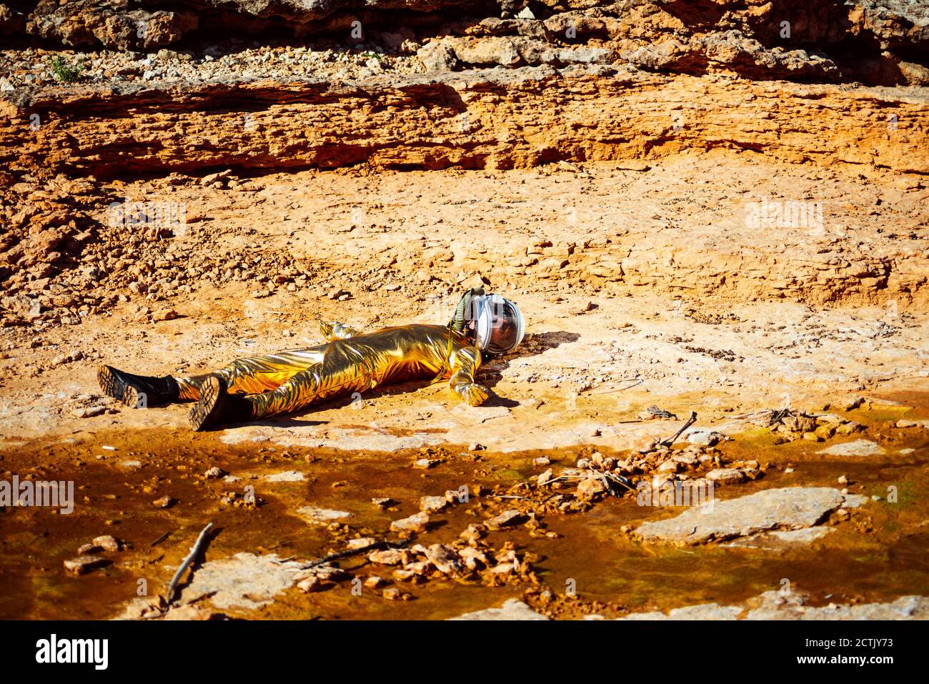 Astronaut lying down on moon Stock Photo - Alamy