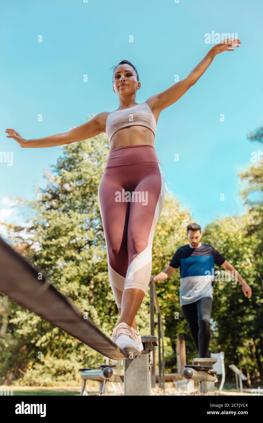 Woman balancing on slackline hi-res stock photography and images - Alamy