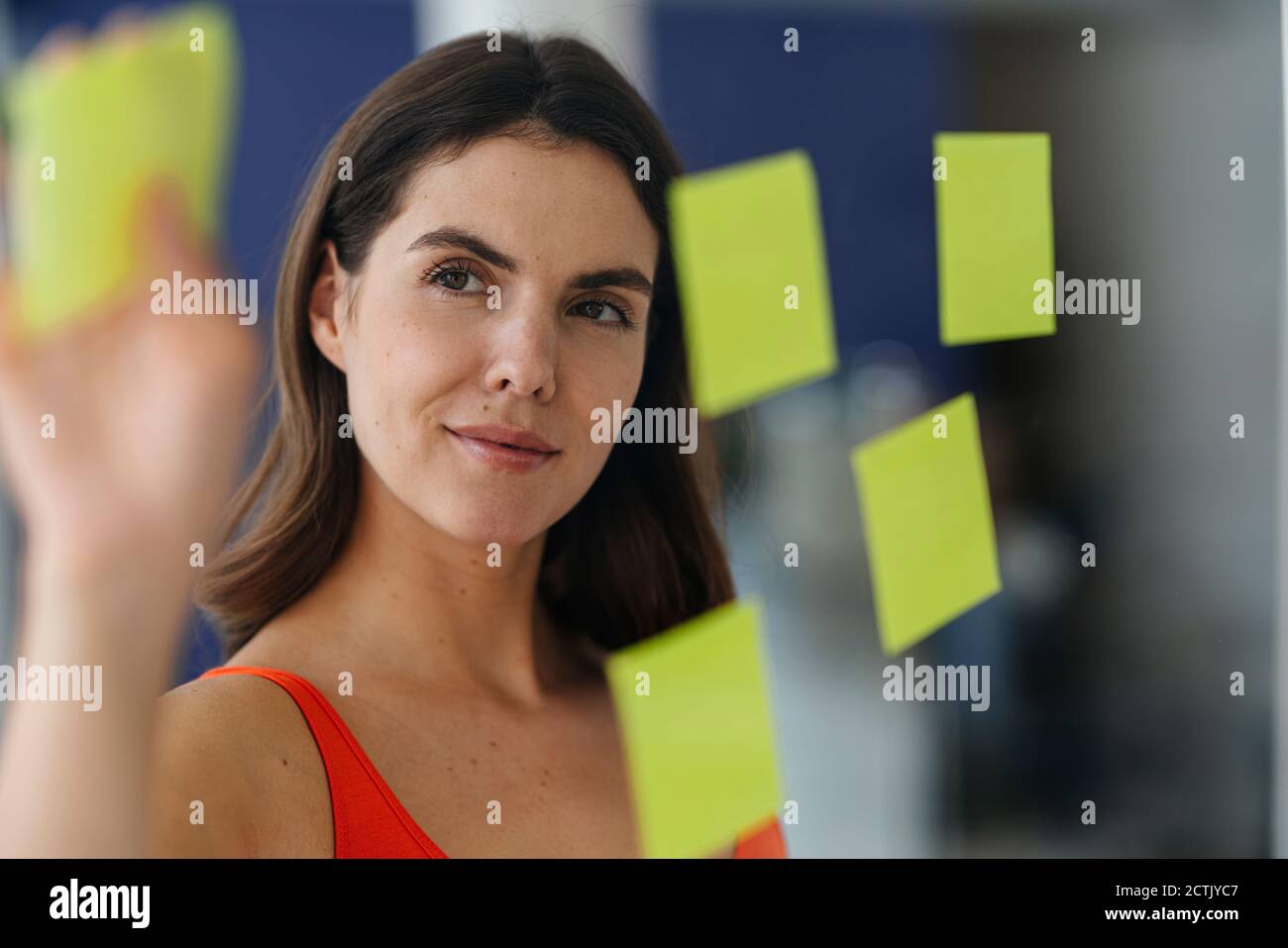 Woman focus on working post it hi-res stock photography and images - Alamy
