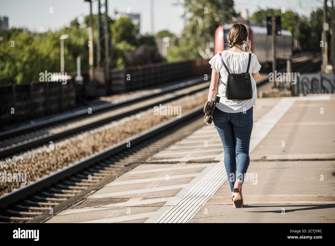 Woman walking on platform hi-res stock photography and images - Alamy