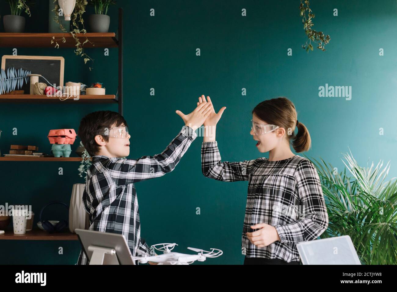 Happy siblings giving high hi-res stock photography and images - Alamy