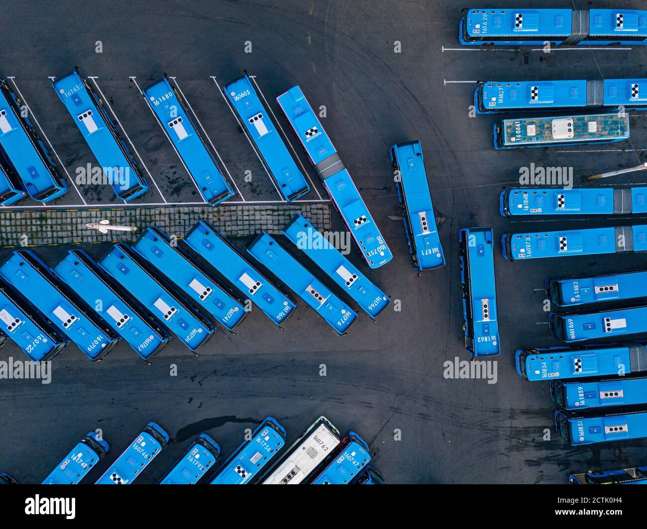 Aerial view of parking lot filled with blue buses Stock Photo - Alamy