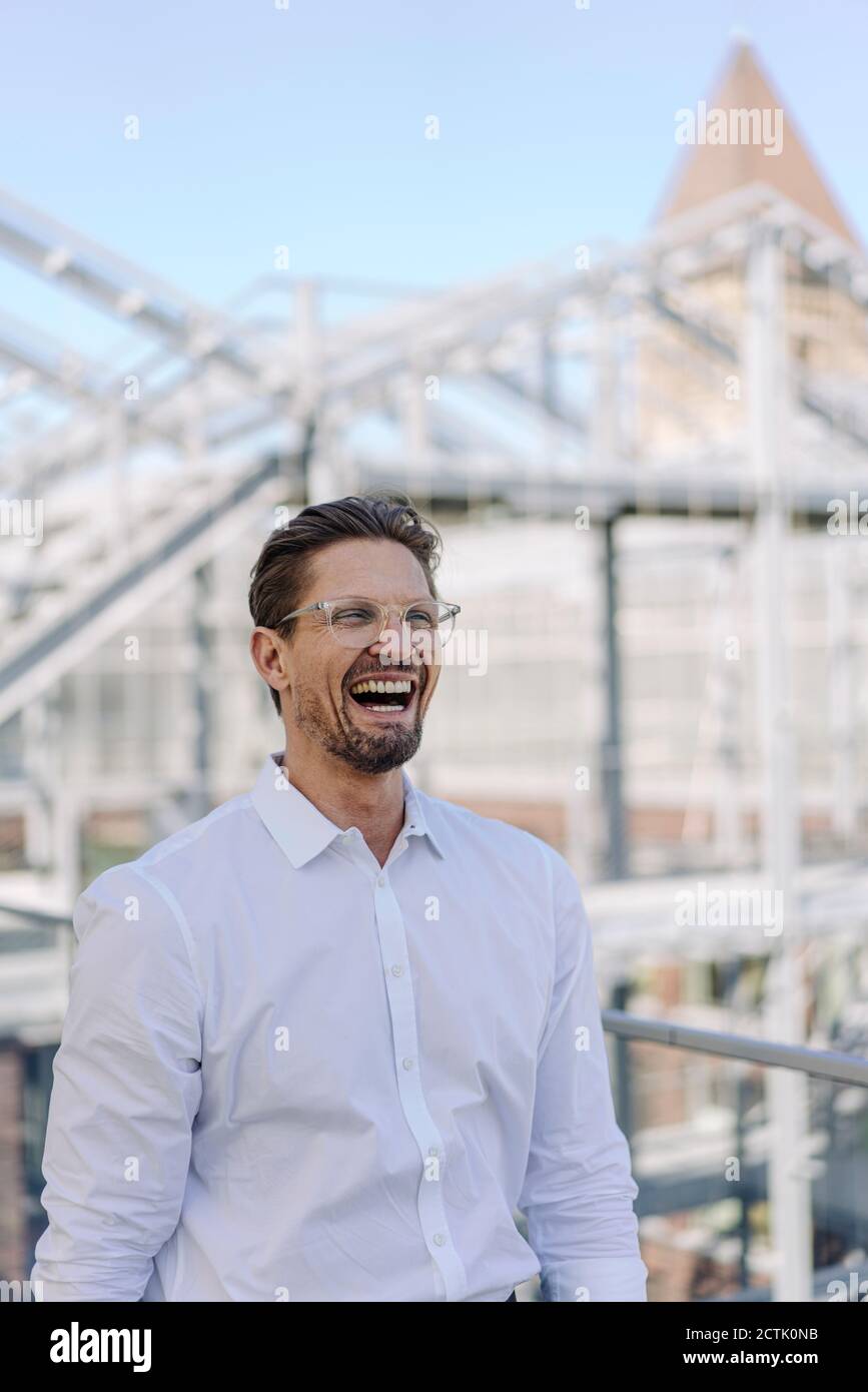 Businessman laughing standing hi-res stock photography and images - Alamy