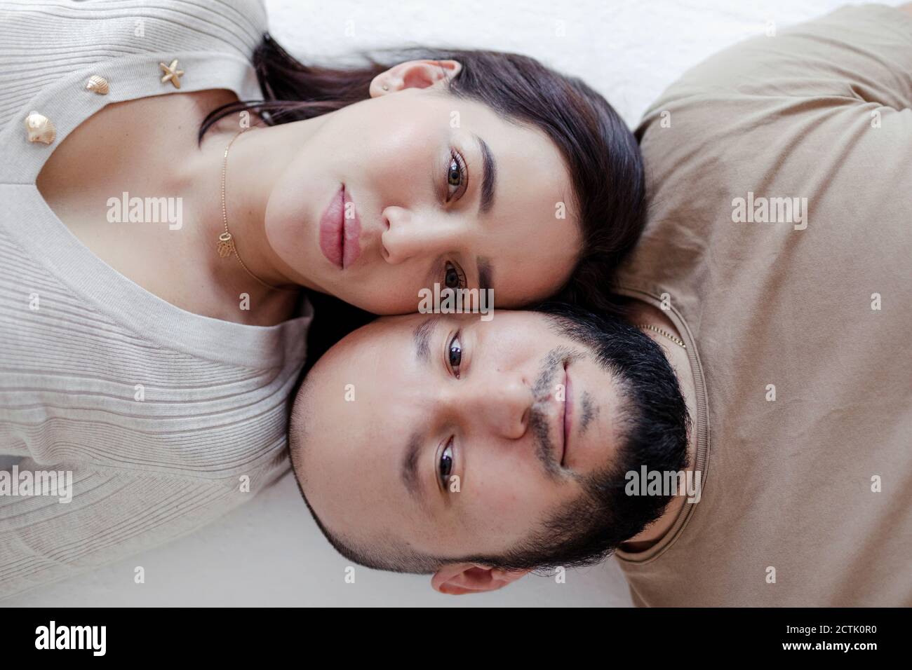 Overhead shot couple lying on hi-res stock photography and images - Alamy