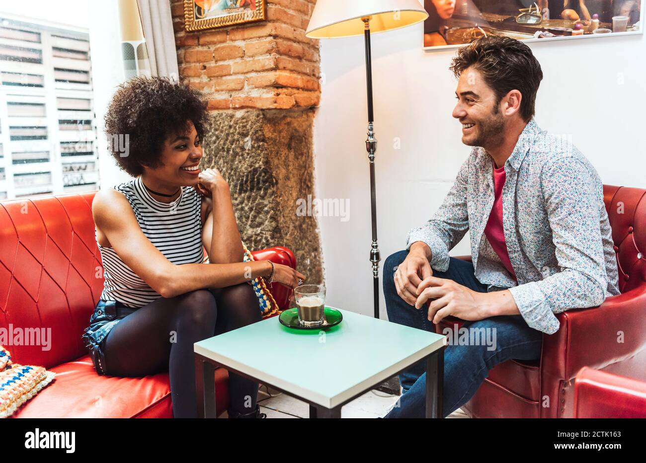Group cheerful people sitting table hi-res stock photography and images ...