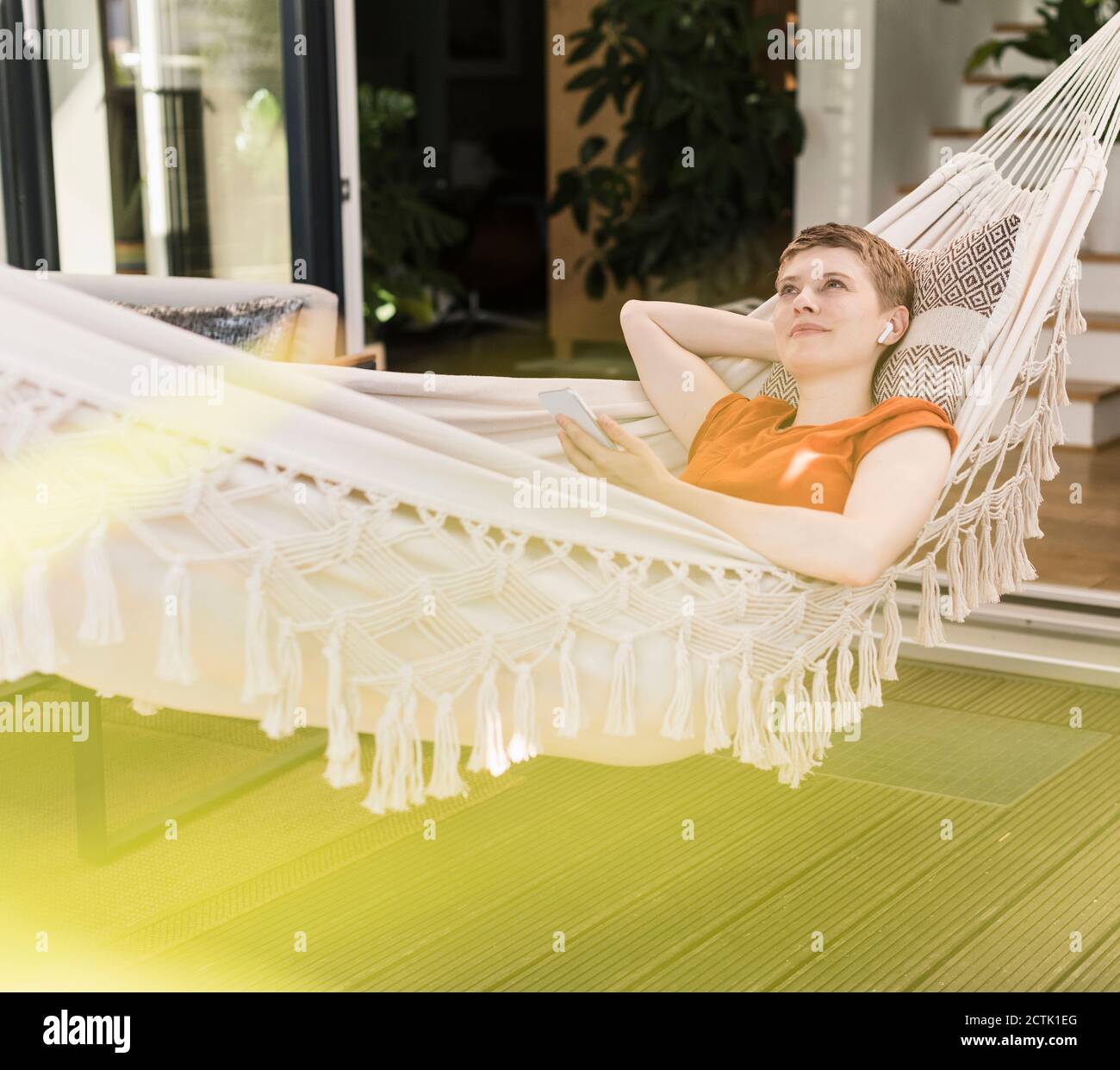Thoughtful woman lying on back hi-res stock photography and images - Alamy