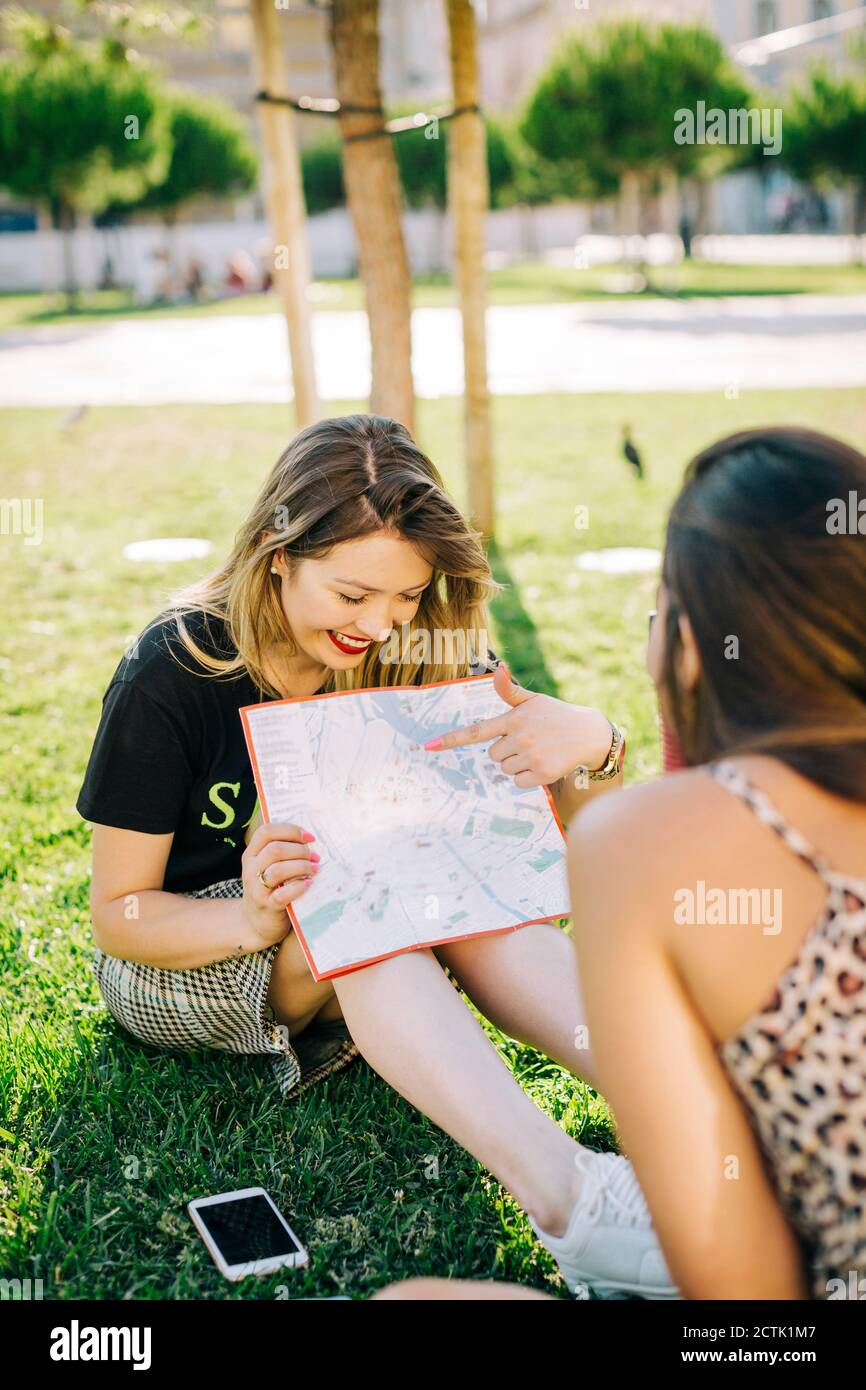 Female pointing at map hi-res stock photography and images - Alamy
