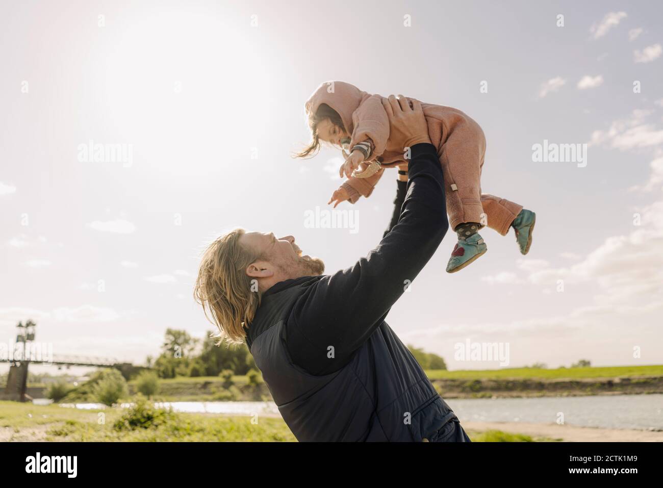 Father lifting up daughter on hi-res stock photography and images - Alamy