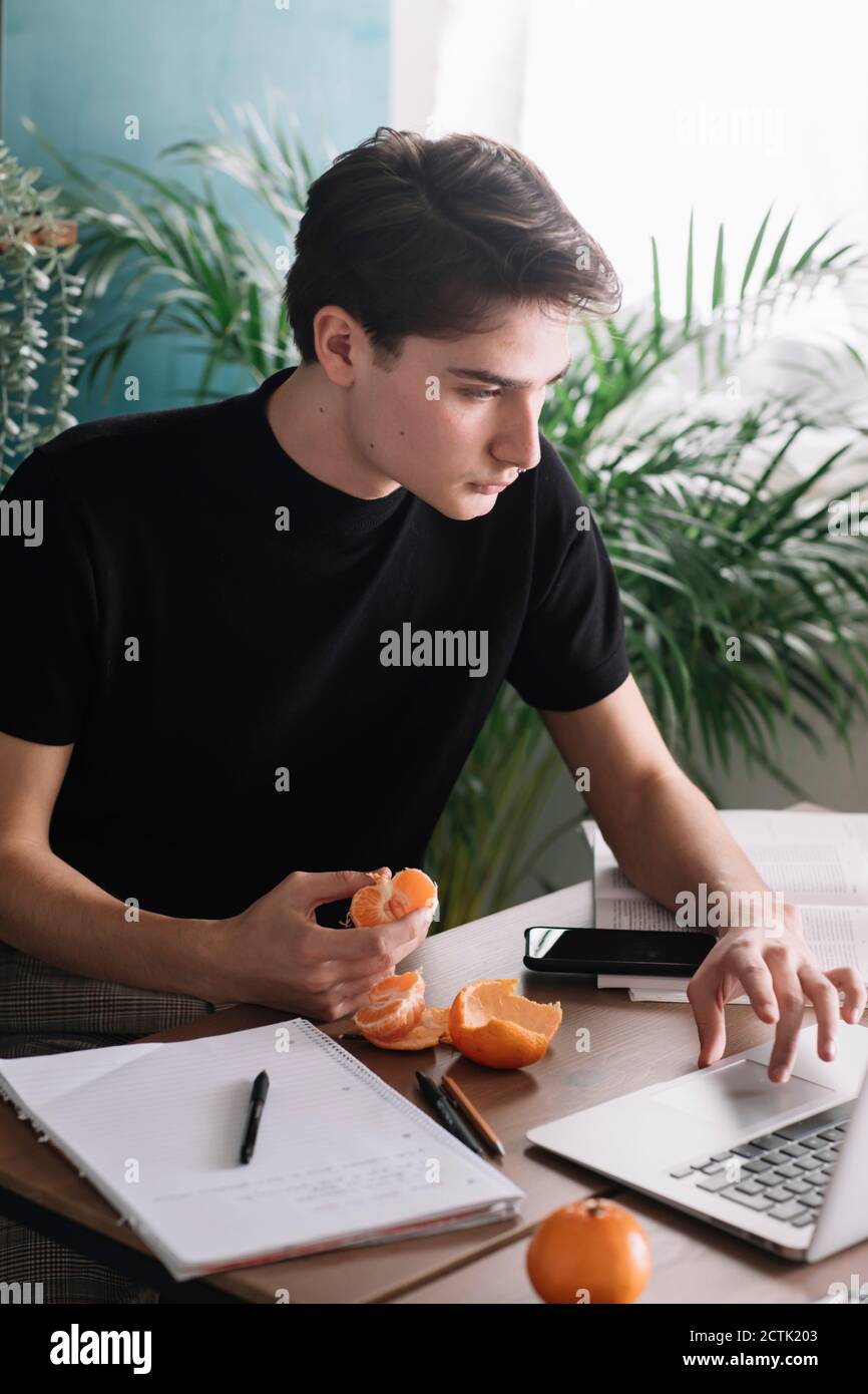 Young man using citrus hi-res stock photography and images - Alamy
