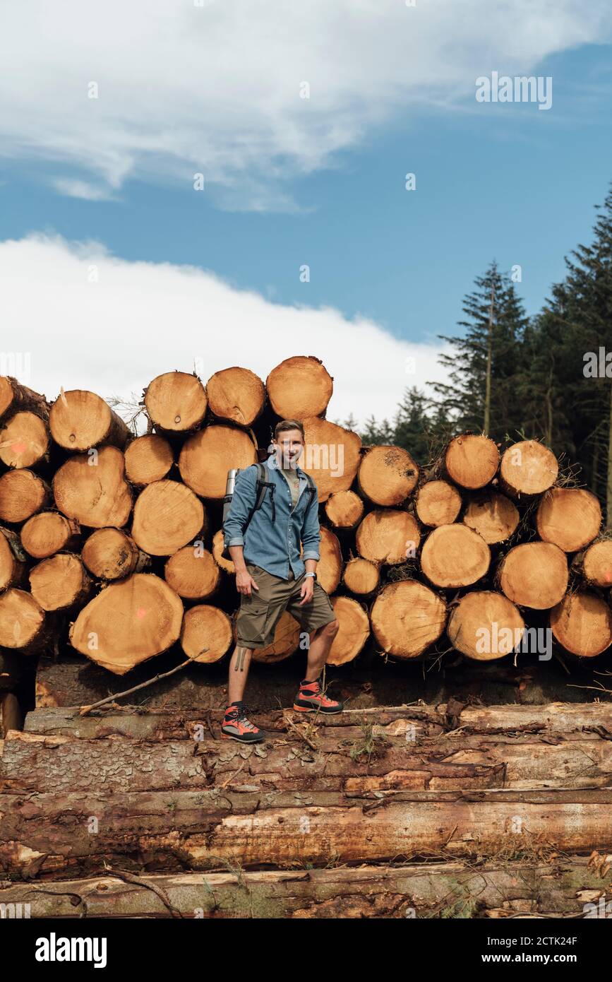 Male on log hi-res stock photography and images - Alamy
