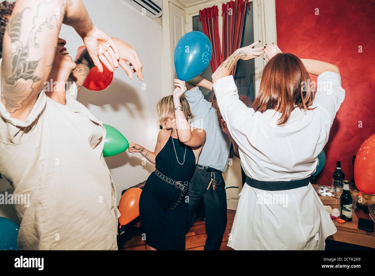 Friends dancing during social gathering at home Stock Photo - Alamy