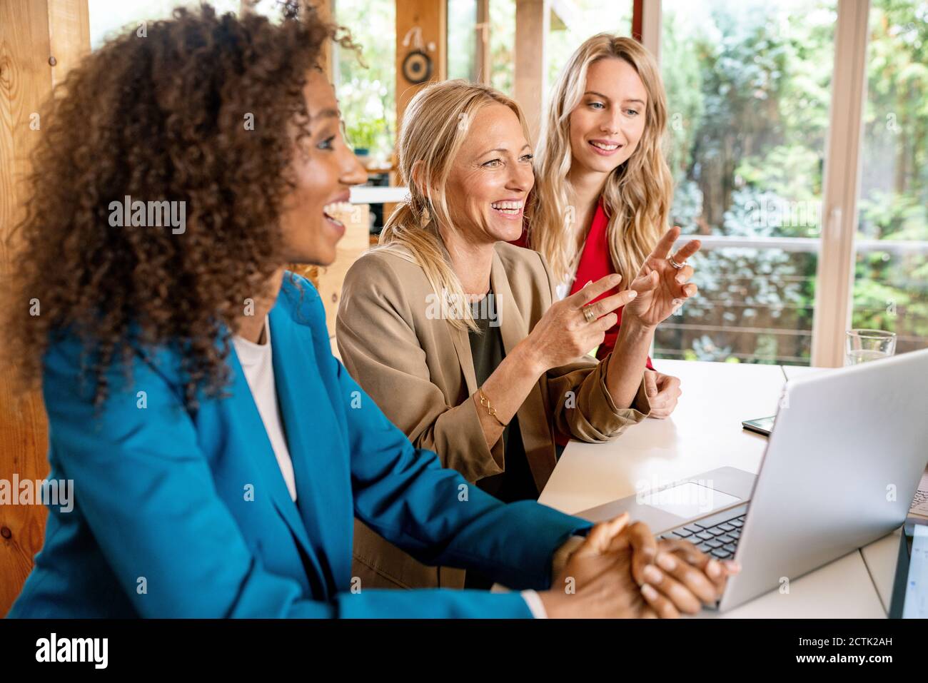 Female Coworkers Laughing High Resolution Stock Photography and Images ...