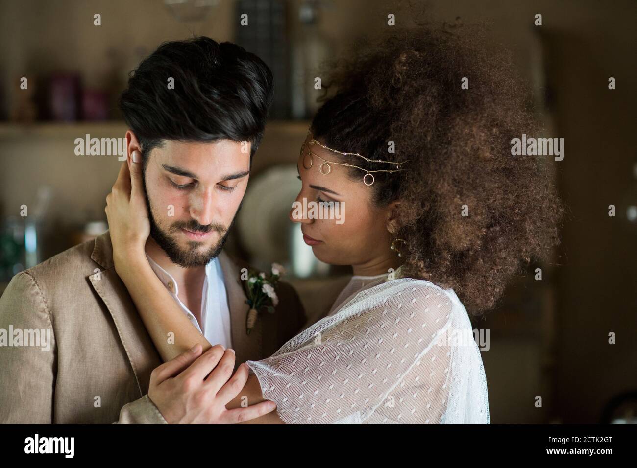 Romantic couple standing in room Stock Photo - Alamy