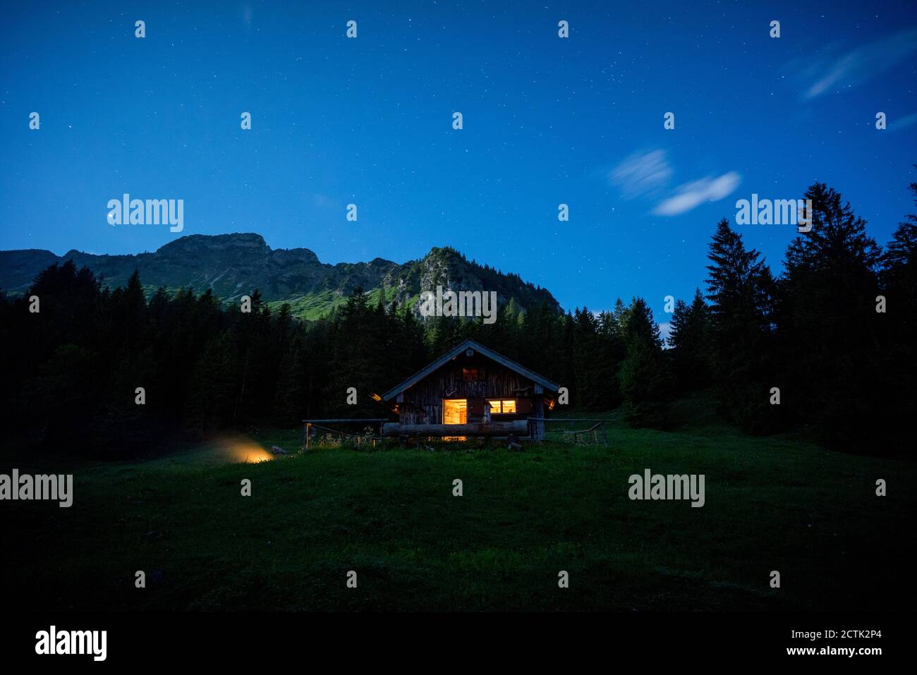 Secluded mountain hut at night Stock Photo - Alamy