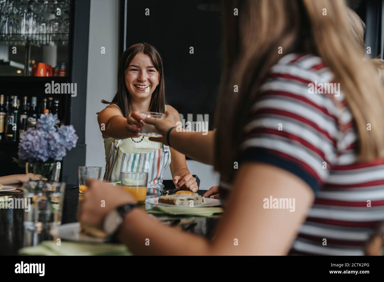 Group of teenage girls meeting for homemade brunch Stock Photo - Alamy